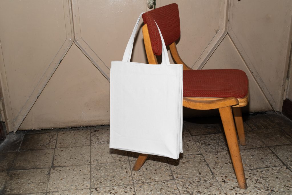 Free Canvas Bag Hanging on Chair Mockup — Mr.Mockup