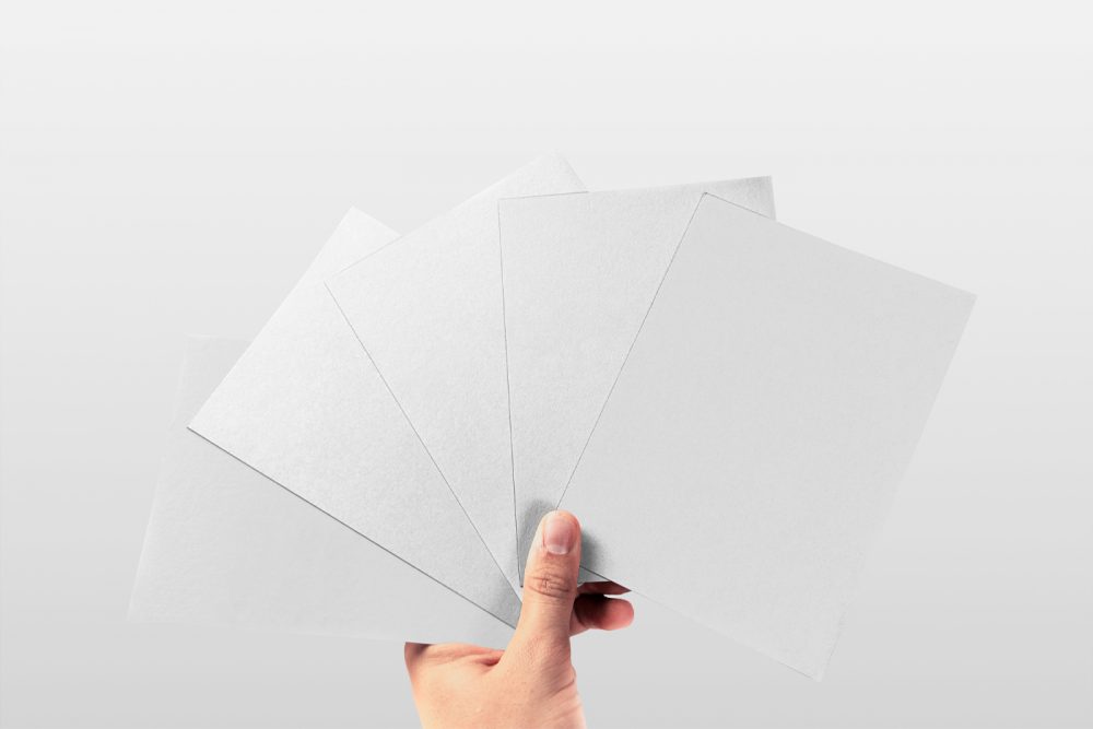 Free Postcards in Hand Mockup — Mr.Mockup