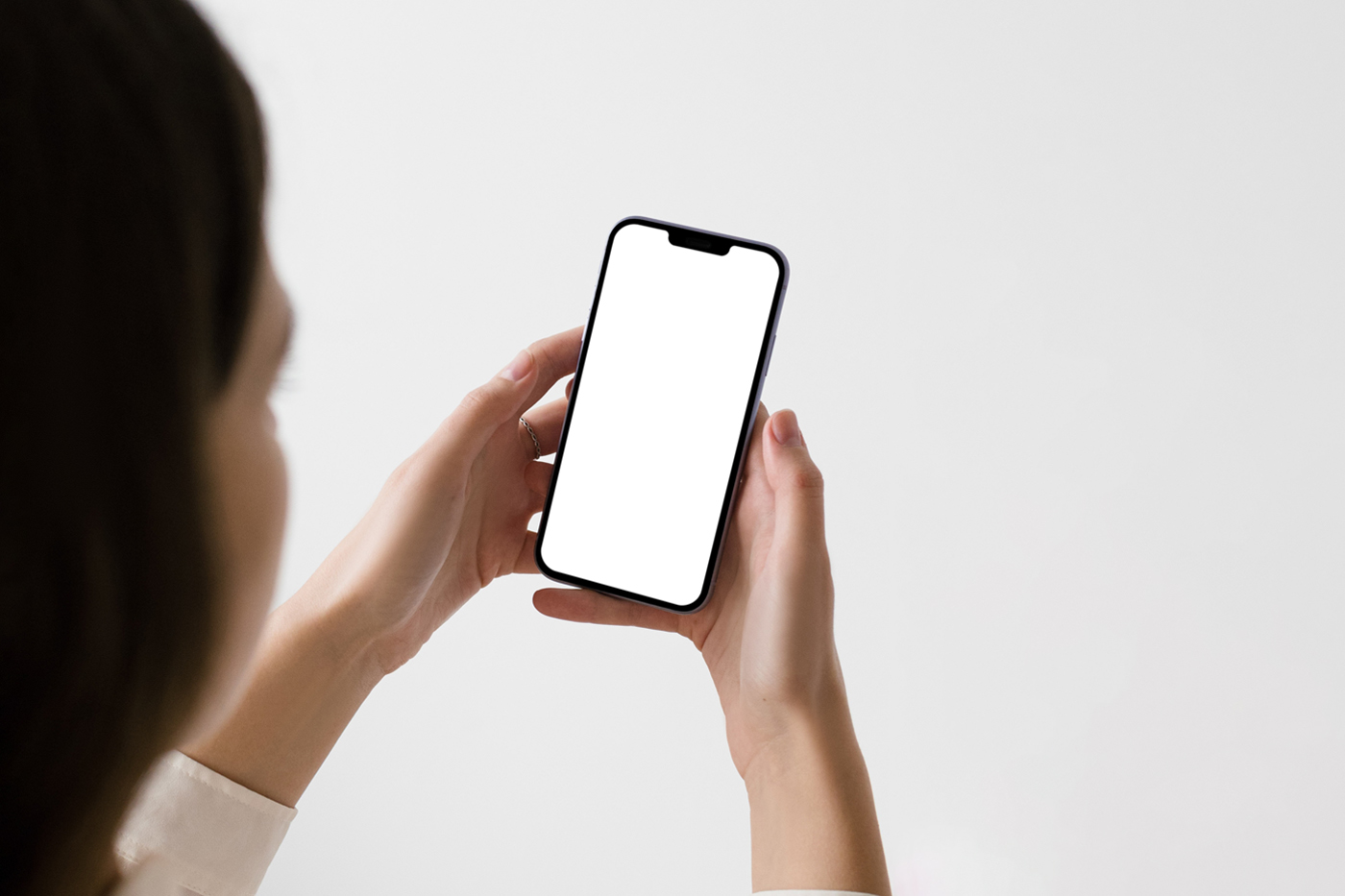 Free iPhone Pro in Woman Hands Mockup — Mr.Mockup