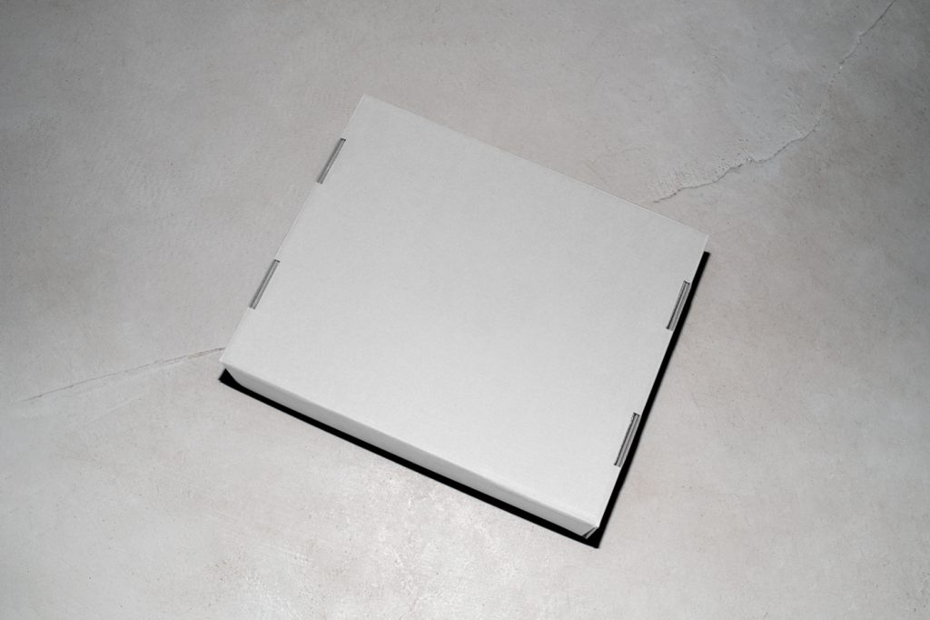 Free Cardboard Box on Floor Mockup — Mr.Mockup